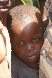 [Kenya] A young boy looks at the camera at Hagadera refugee camp in ...