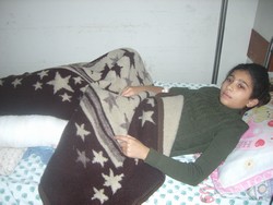 [oPt] Twelve-year-old Huda al-Awadi lies in hospital after she was shot ...