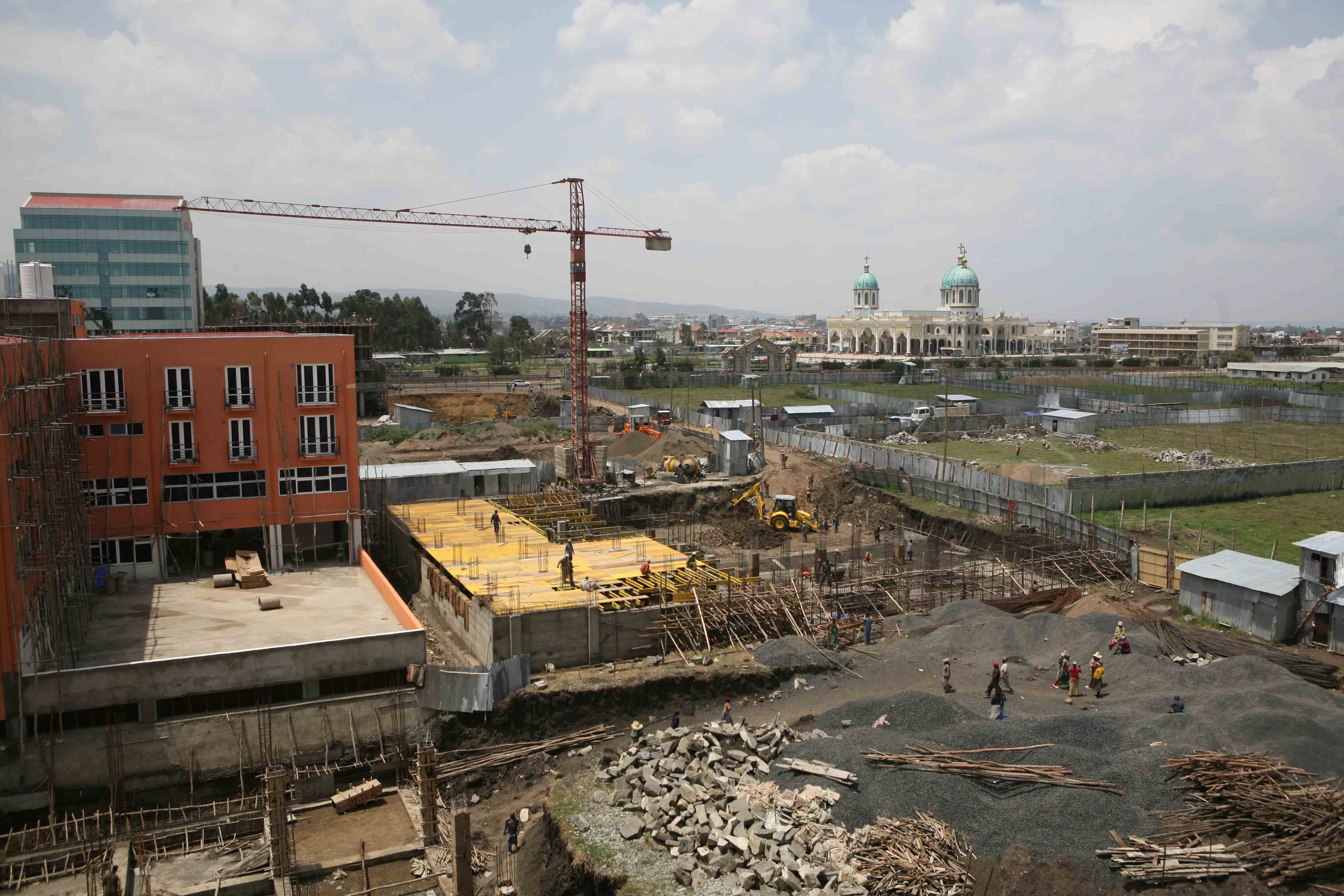 Builders work at a construction site in Addis Ababa, Ethiopia, May 2007 ...