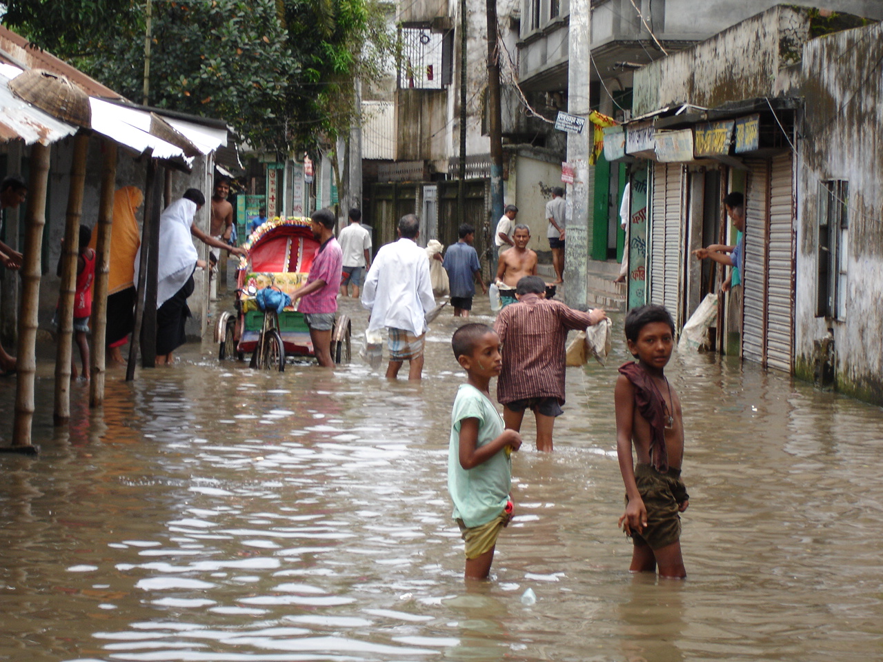 A flood-affected street in Kalachadpur, Dhaka, the Bangladeshi capital. Each year large portions ...