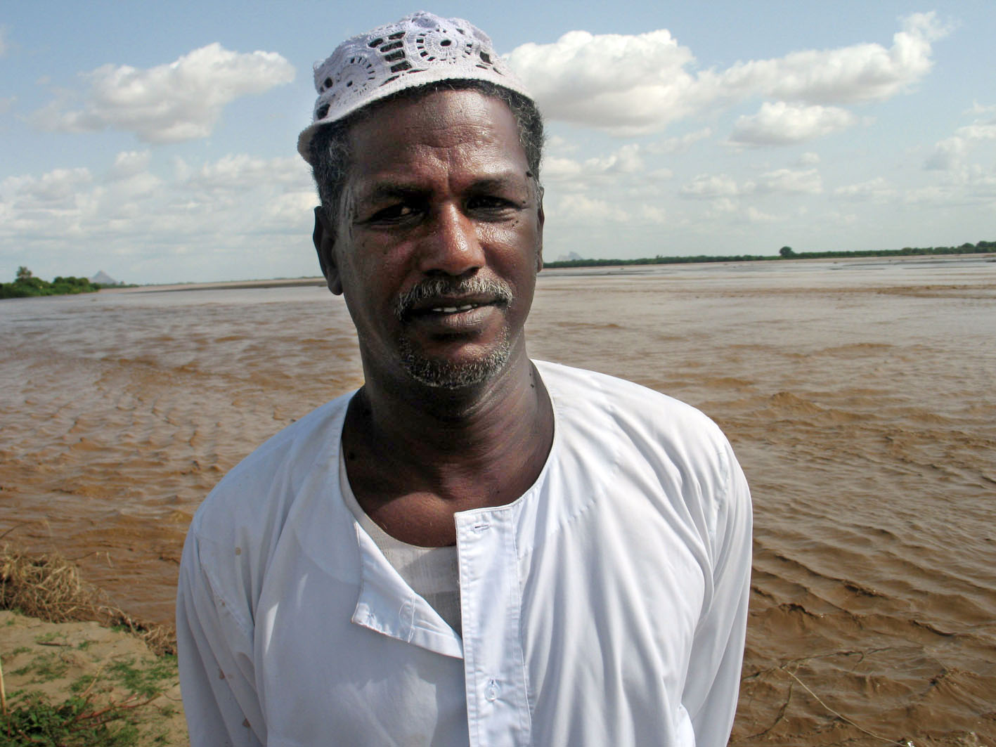 Ali Soliman Dafallah standing near the River Gash in Tamis on the ...