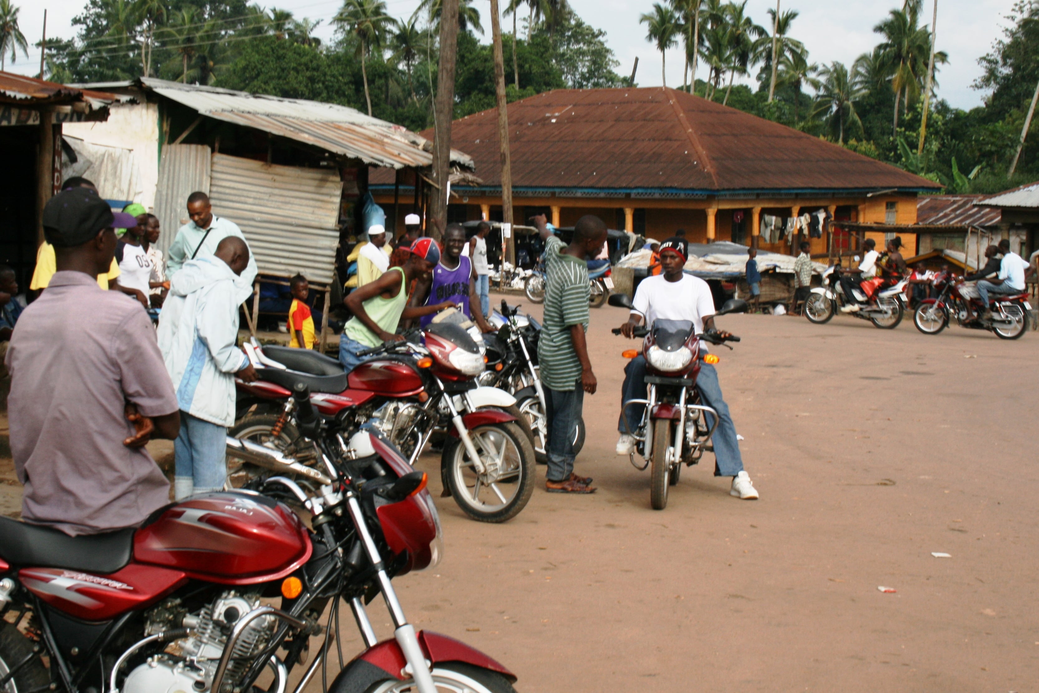 Motercylce taxi drivers known as 'okadas' in Makeni. Many are ex ...