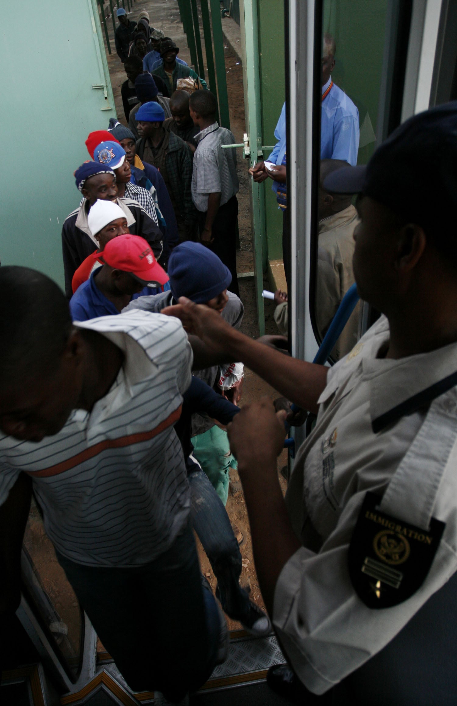 Undocumented migrants about to be deported leaving South Africa's ...