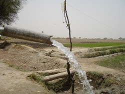 [Pakistan] An irrigation pipe flows with water in Ghotki district in ...