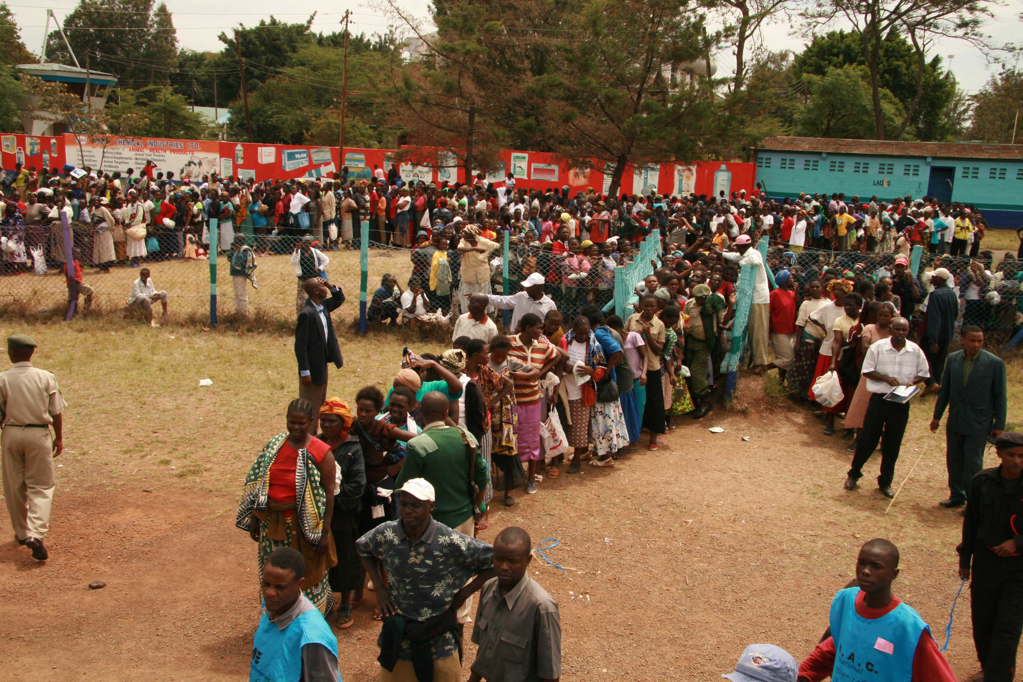 Internally displaced people queue up for food aid at the Jamhuri ...