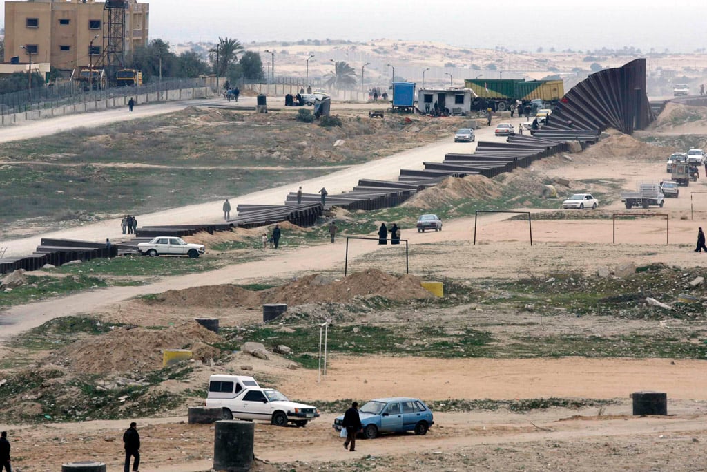 General view of the destroyed section of the border wall seperating the ...