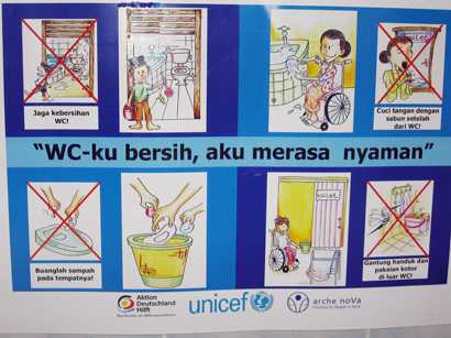 A UNICEF poster encourages communities to wash their hands. It is part ...