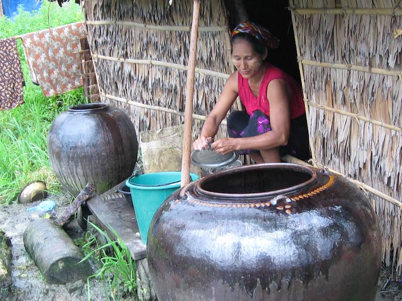 Traditionally, these large ceremic pots are used to hold rain water in ...
