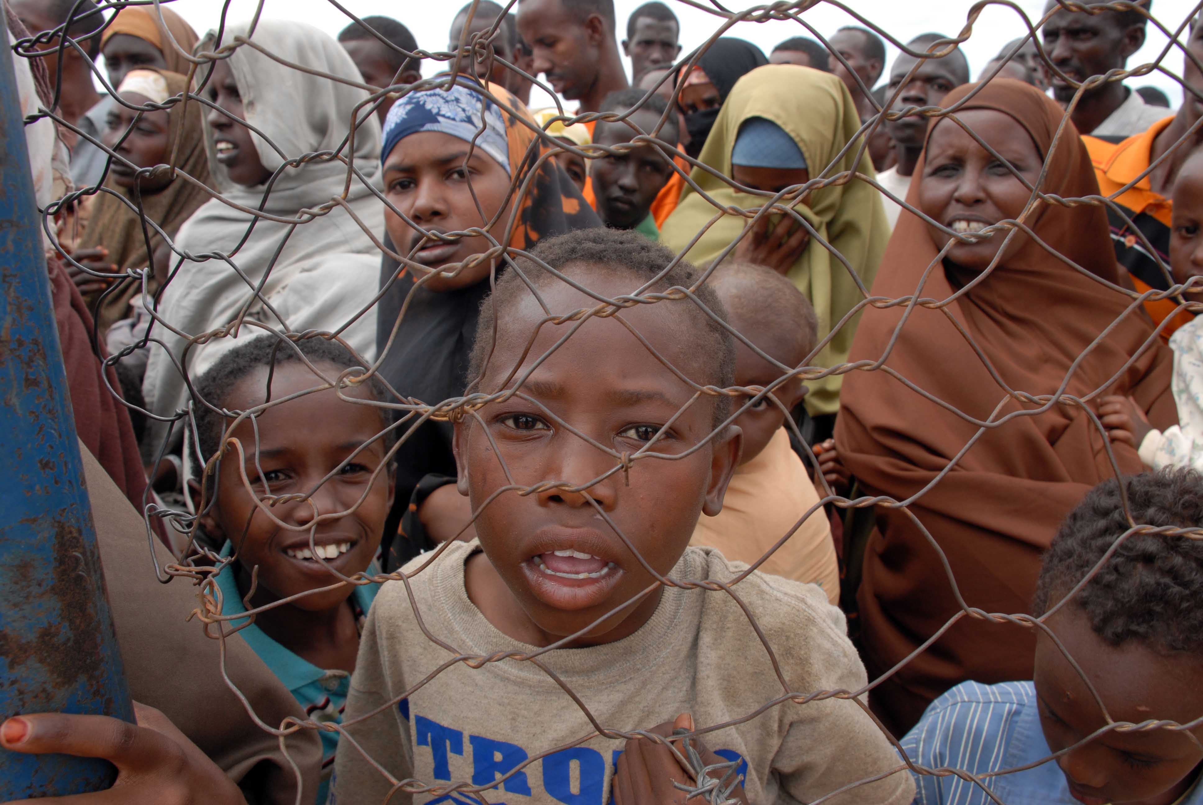 Refugees are controlled as they get into the UNHCR Dadaab camp for ...