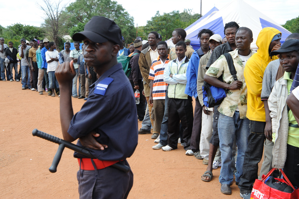 Private security guards oversee Zimbabwean asylum seekers applying for ...