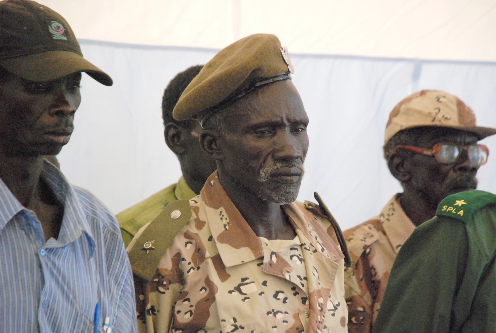 Former fighters from the Sudan People's Liberation Army (SPLA) line up ...