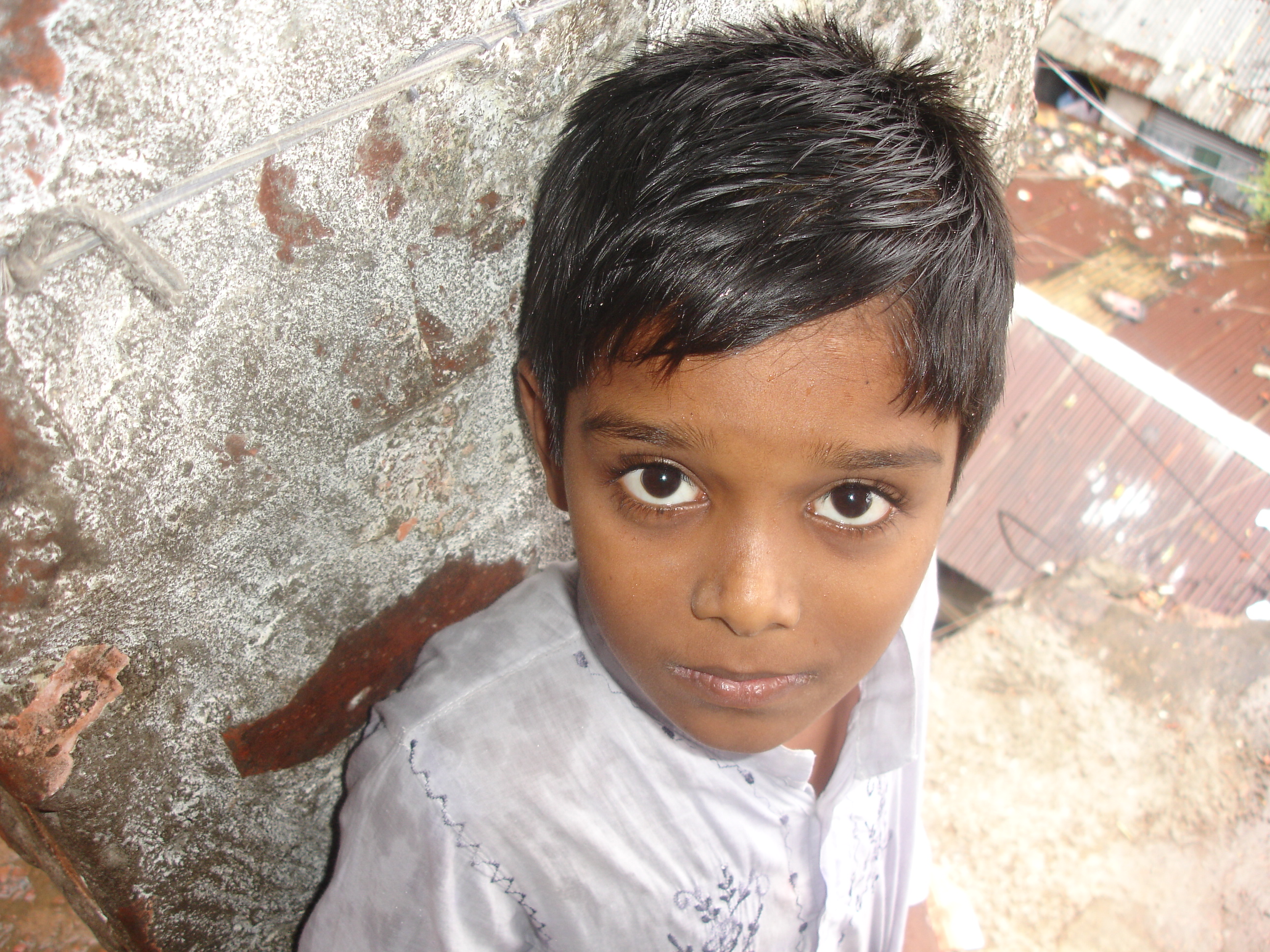 A young Bihari boy in Dhaka, Bangladesh | The New Humanitarian