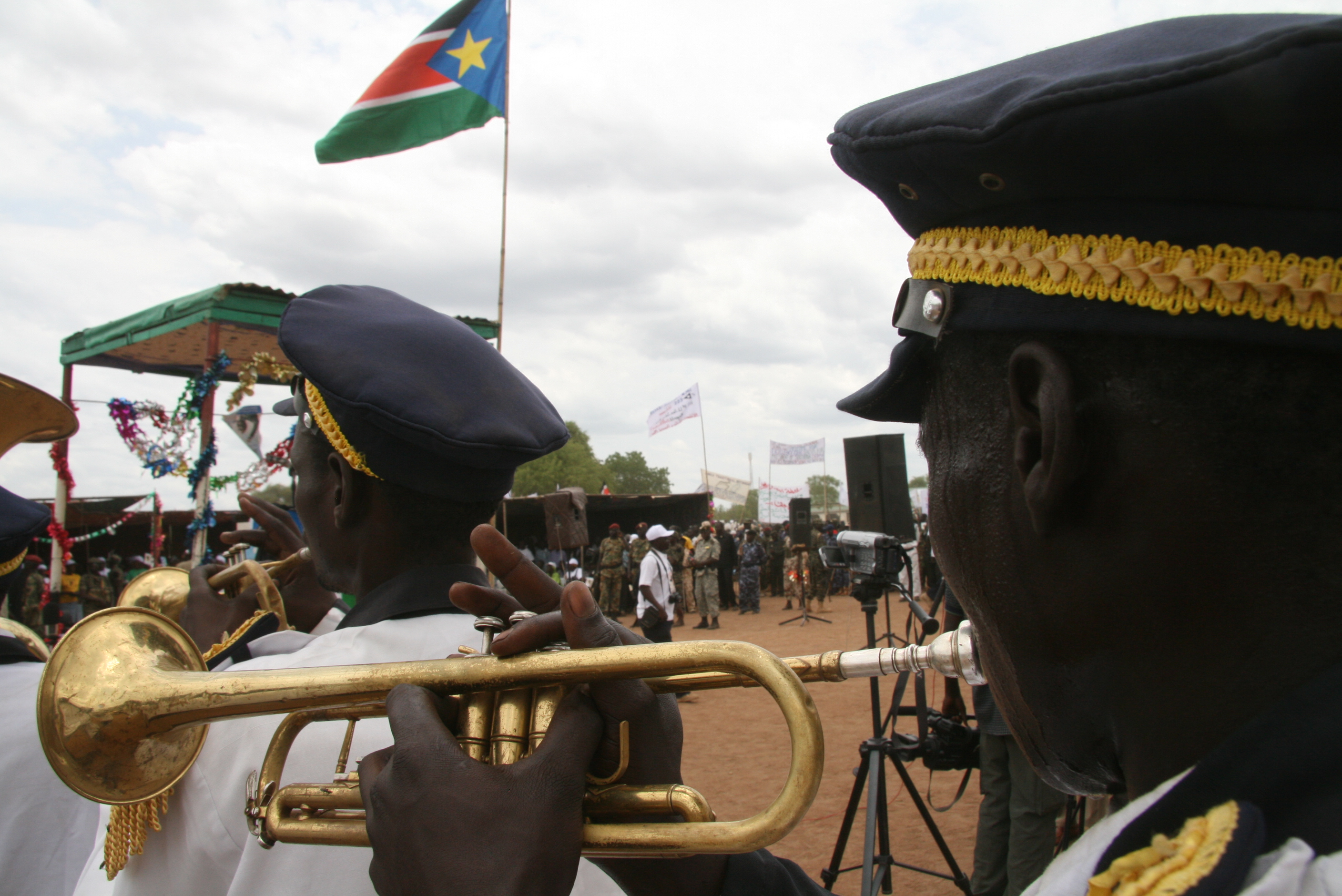 A trumpeter in an SPLA band feels the heat at an election rally in ...