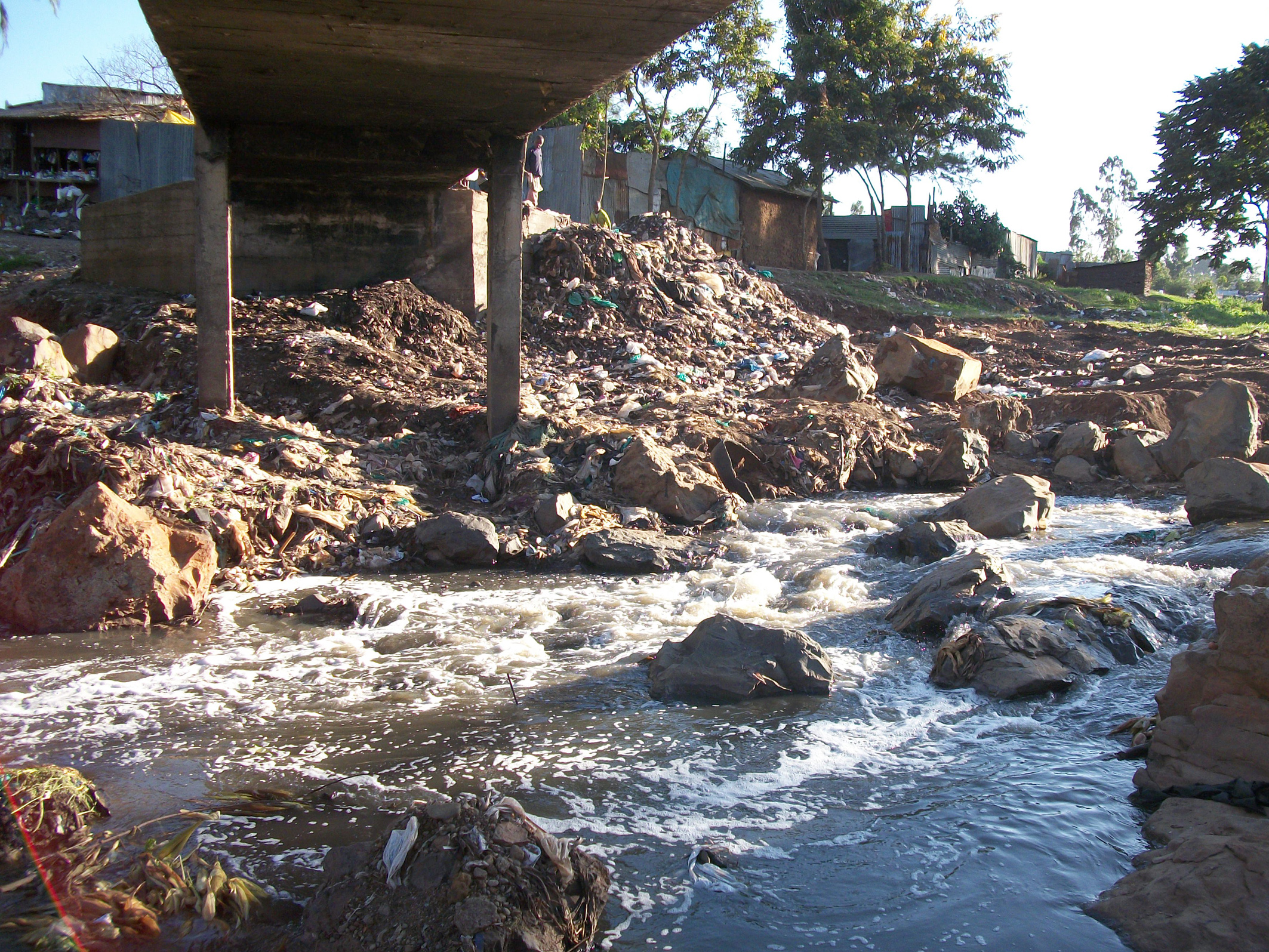 The highly polluted Nairobi River. Without a proper garbage collection ...