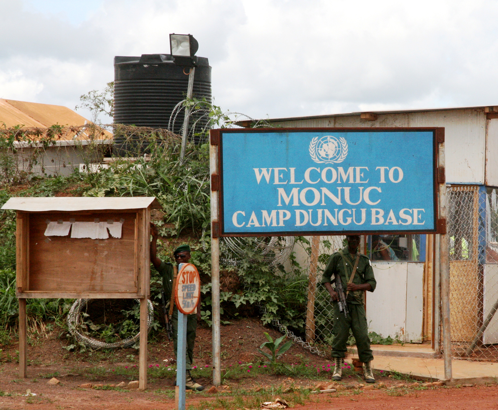 DRC soldiers stand guard outside a MONUC base in Dungu, in Haut Uele ...