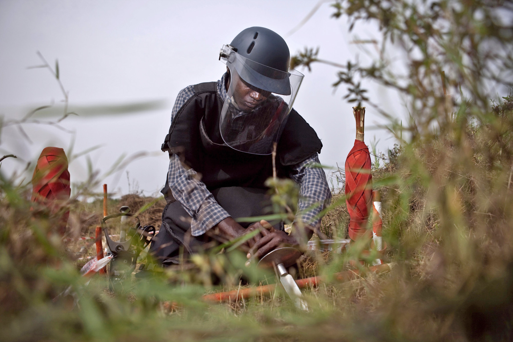 A deminer in action at Bangboka airport. Bangboka serves the eastern ...