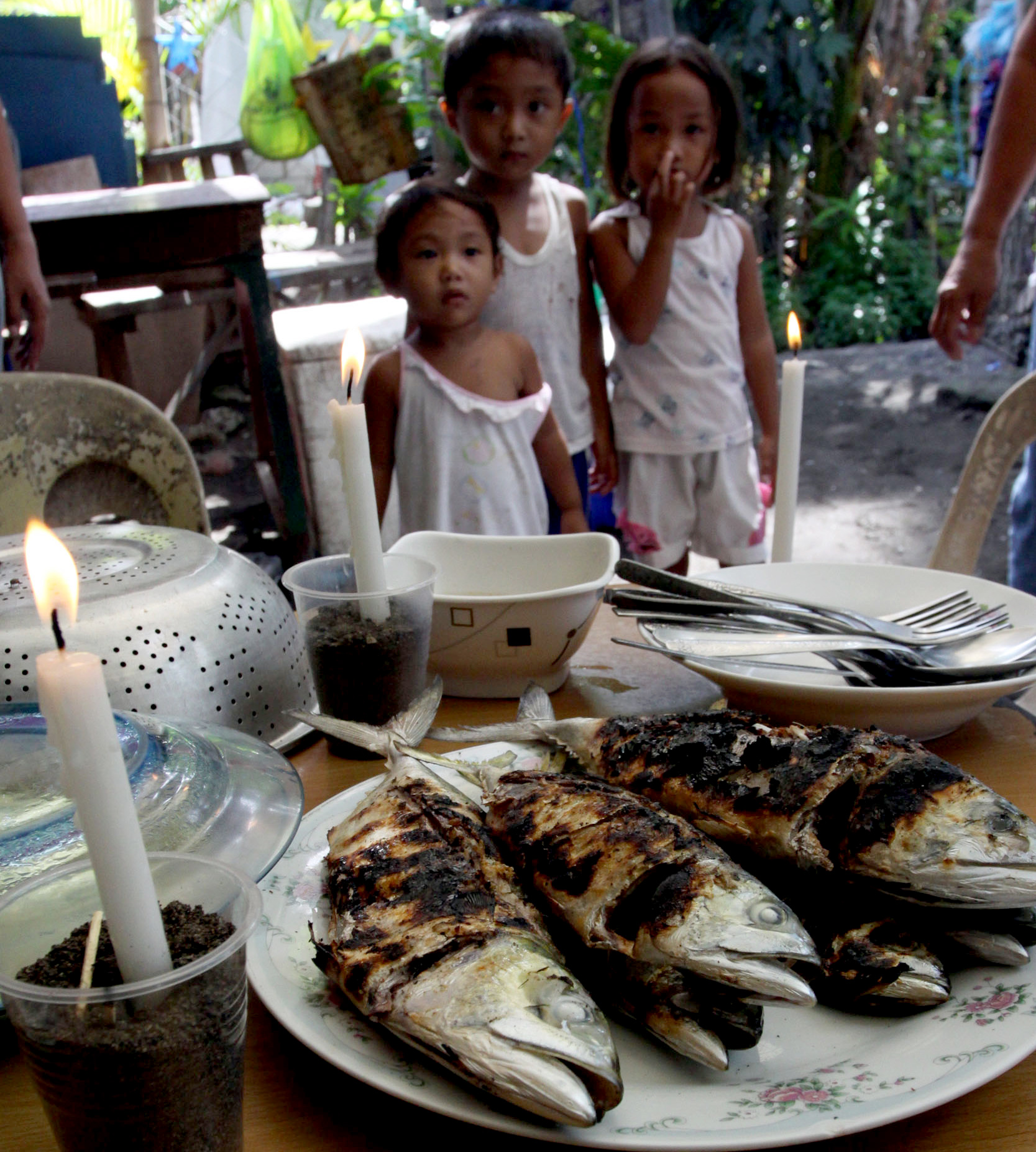 The day's catch is cooked and served for the children in Cavite ...