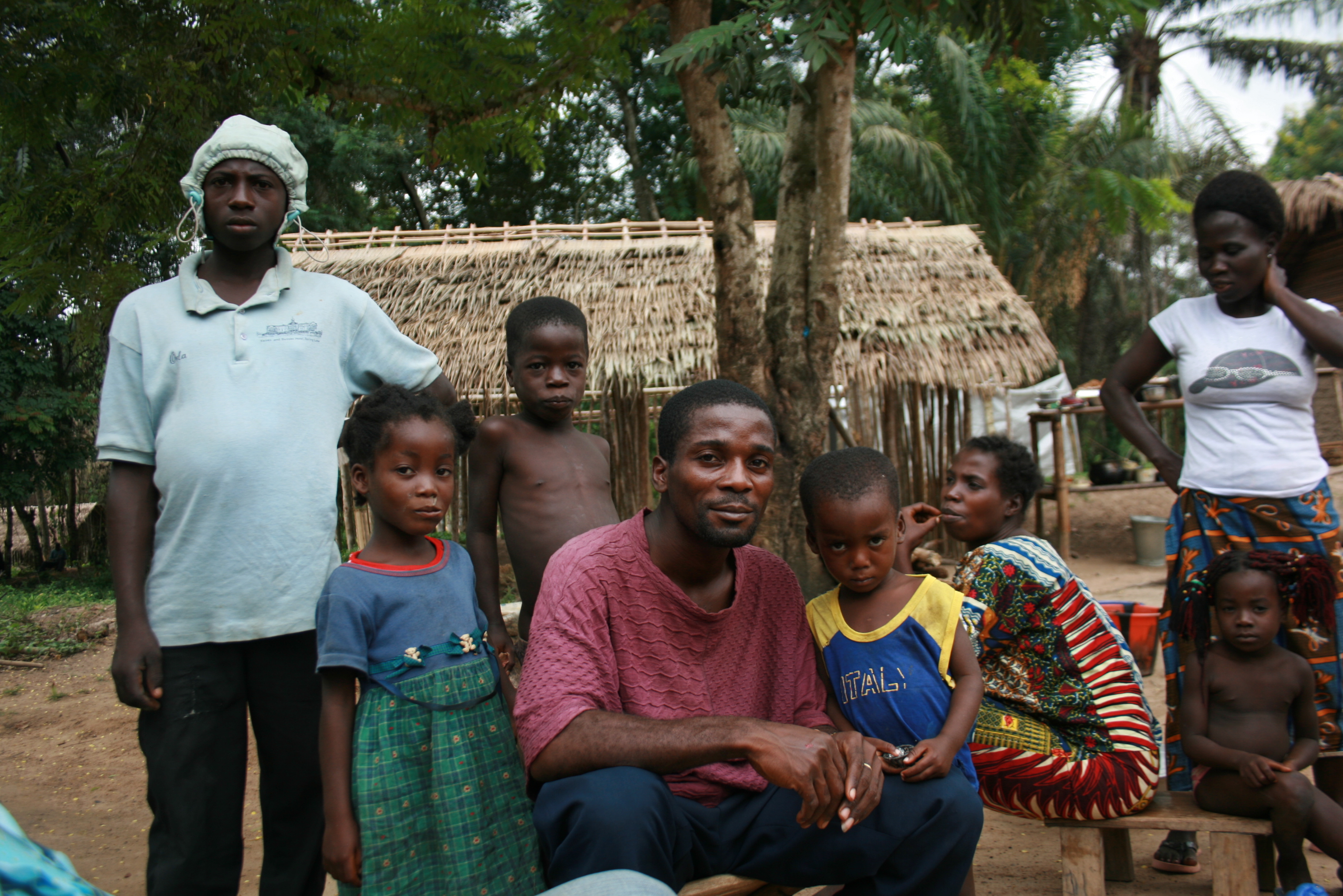 Thomas Roo (centre) is a Liberian who lives in Janzon Axis village. He ...