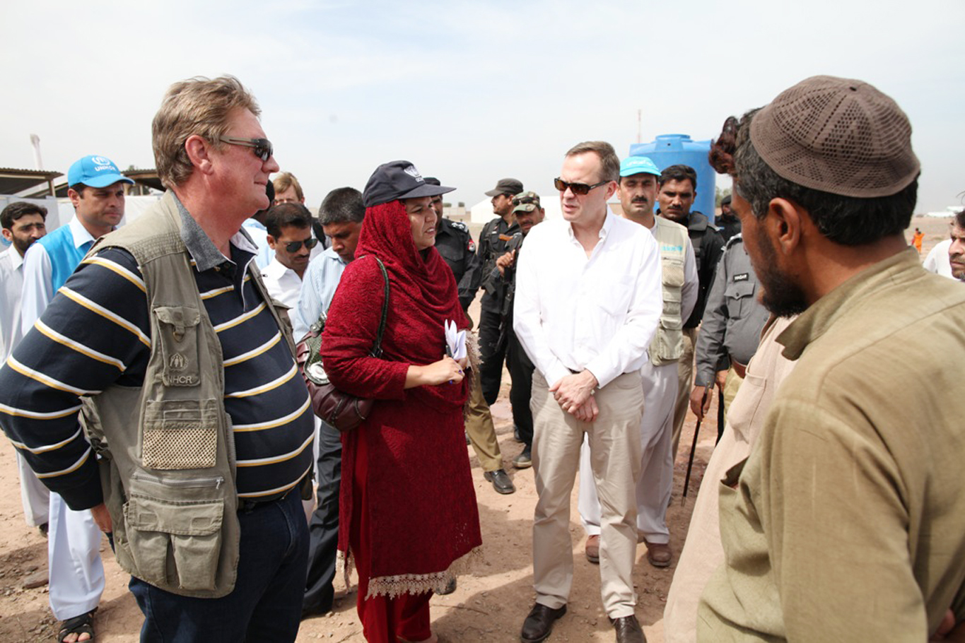 A UNHCR team talks with new arrivals at Jalozai Camp | The New Humanitarian