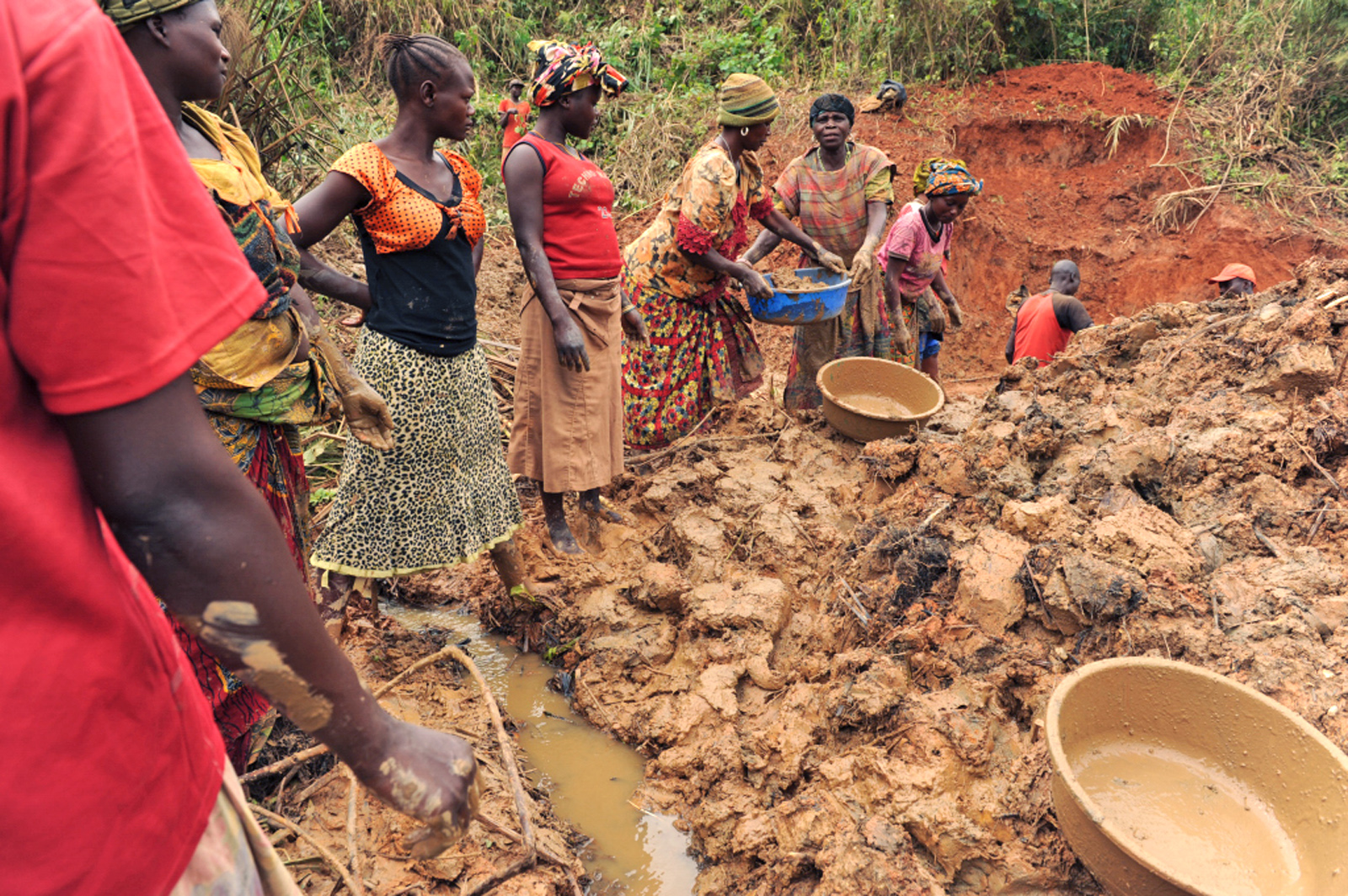 Women provide extensive labour at the gold mine workings, where all ...
