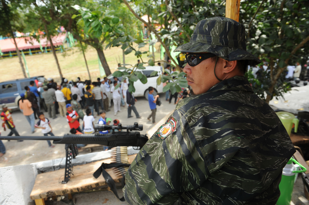 Security at a rally at the MILF-BIAF 106 base command in Esperanza ...