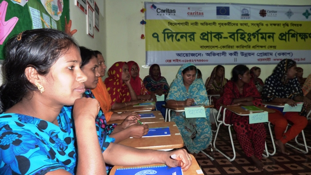 A group of women in Dhaka receiving training before traveling abroad to ...