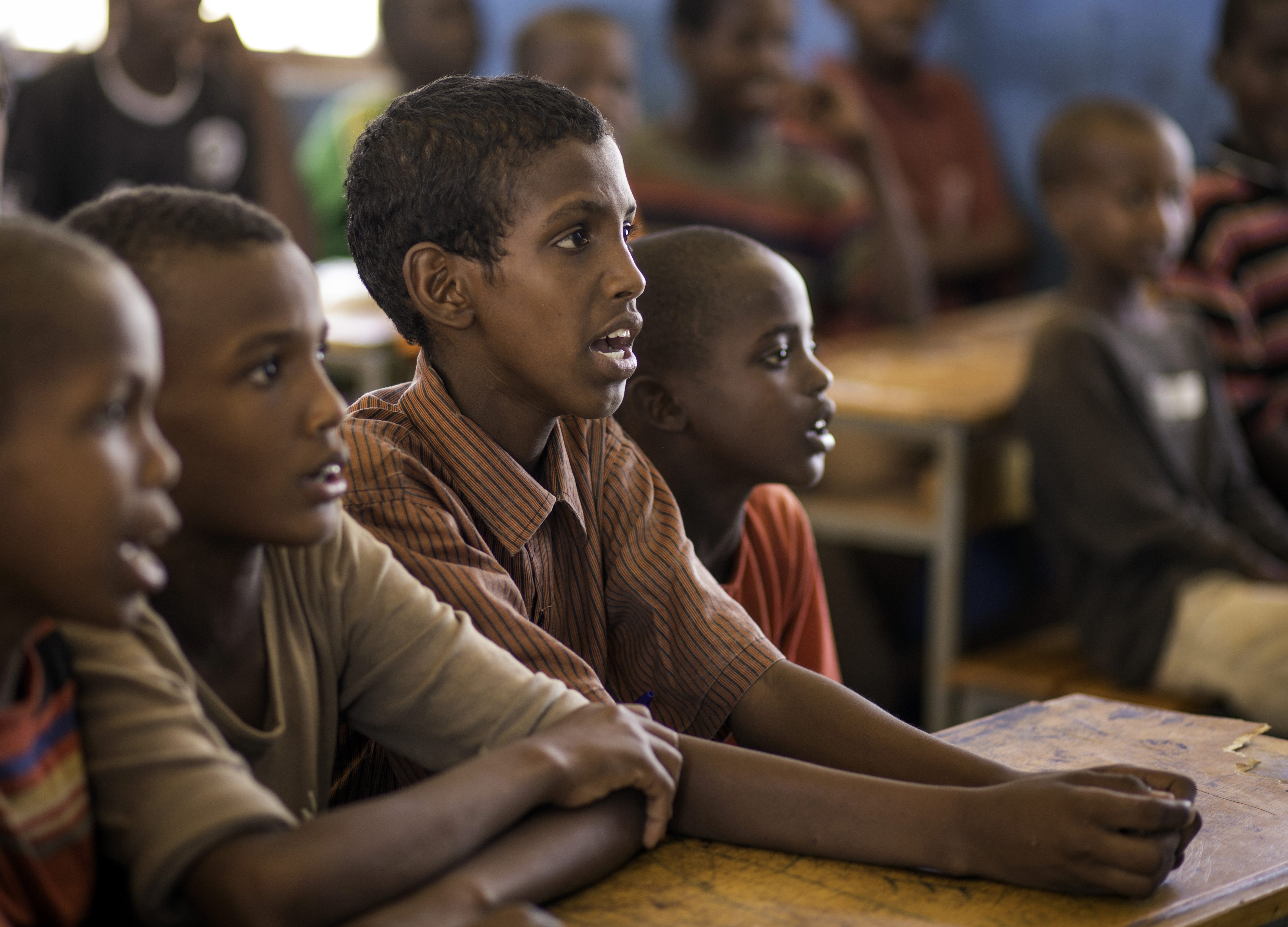 Somali refugee children learn English at a primary school in Kobe ...