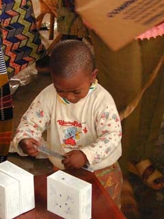 [Congo] Child awaiting BP5 high nutrient biscuit distribution in ...